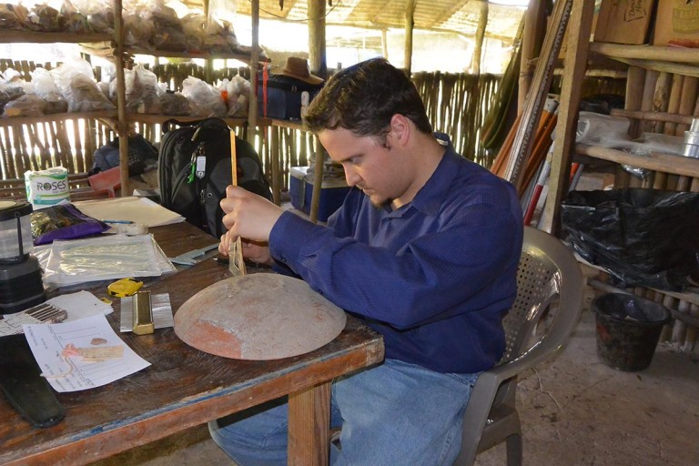 12. Adrian Drawing Pottery_3263 - Caracol Archaeological Project